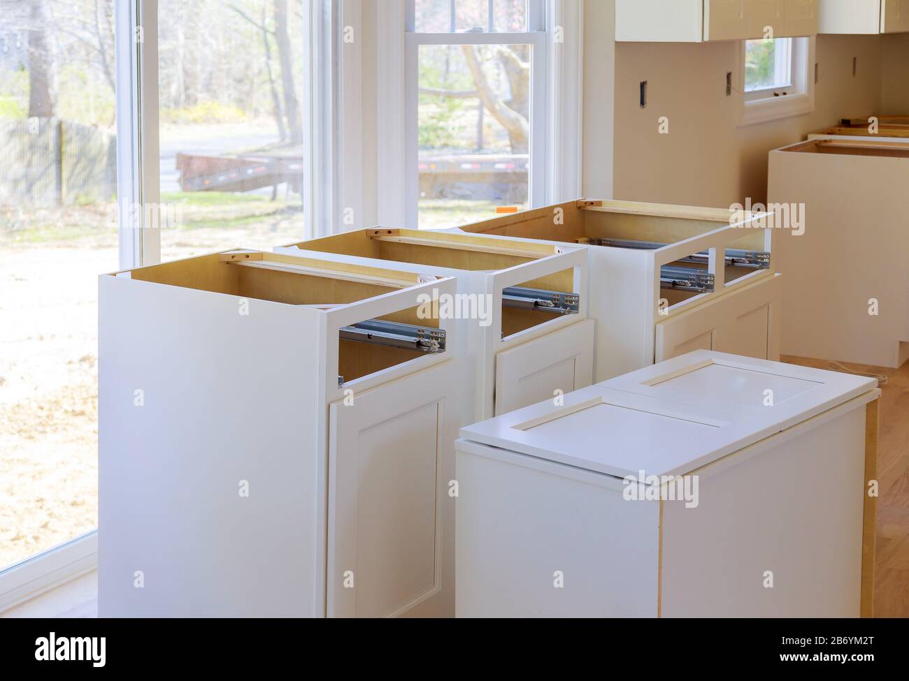 Installing new cabinet in a home improvement kitchen view installed in ...