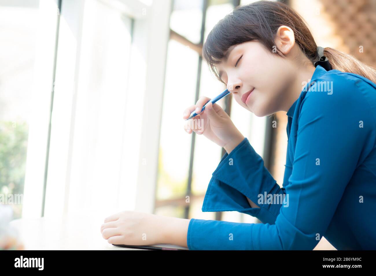 Beautiful portrait young asian woman writer smiling thinking idea and ...
