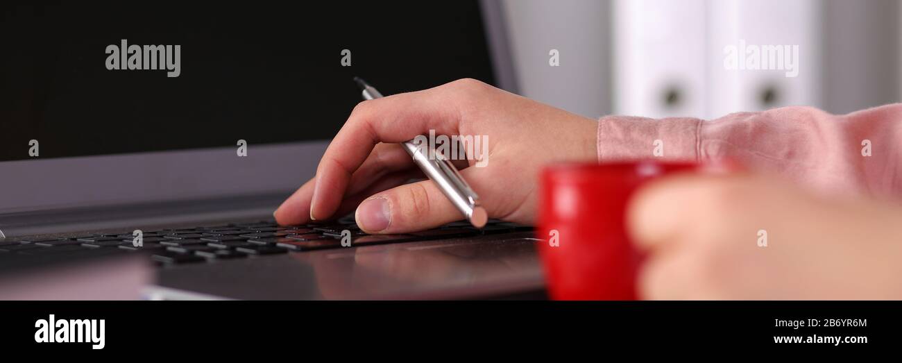 Female hands push buttons on laptop keyboard Stock Photo - Alamy