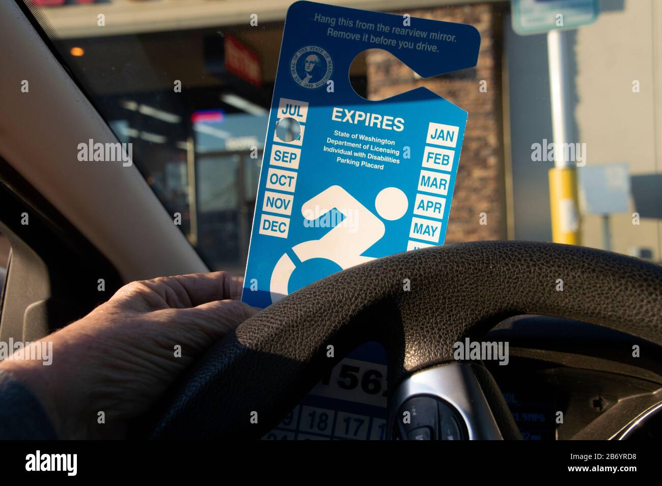 Handicap parking sticker Stock Photo - Alamy