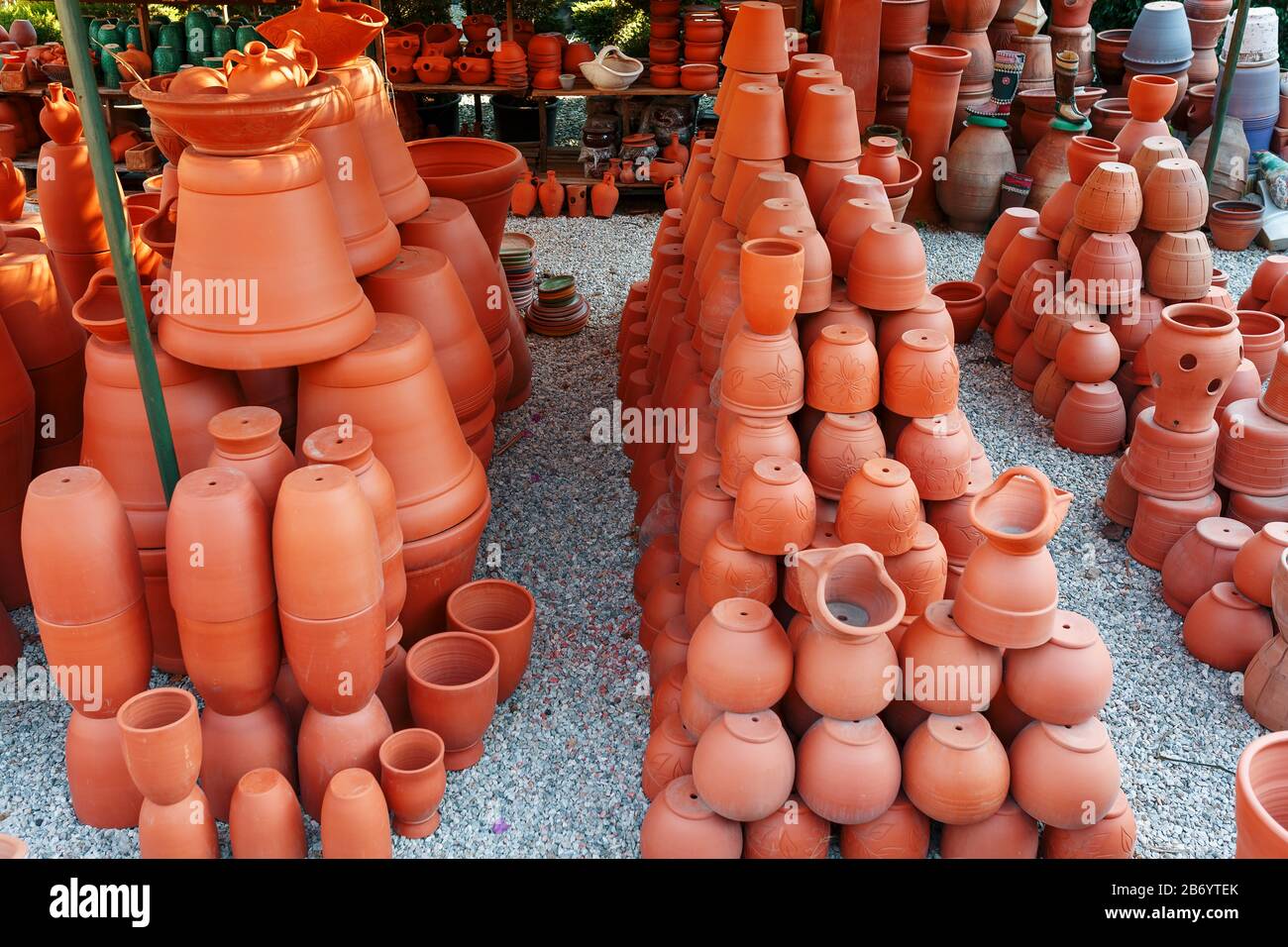 Handmade ceramic crockery made of clay of brown terracotta color. Cups ...