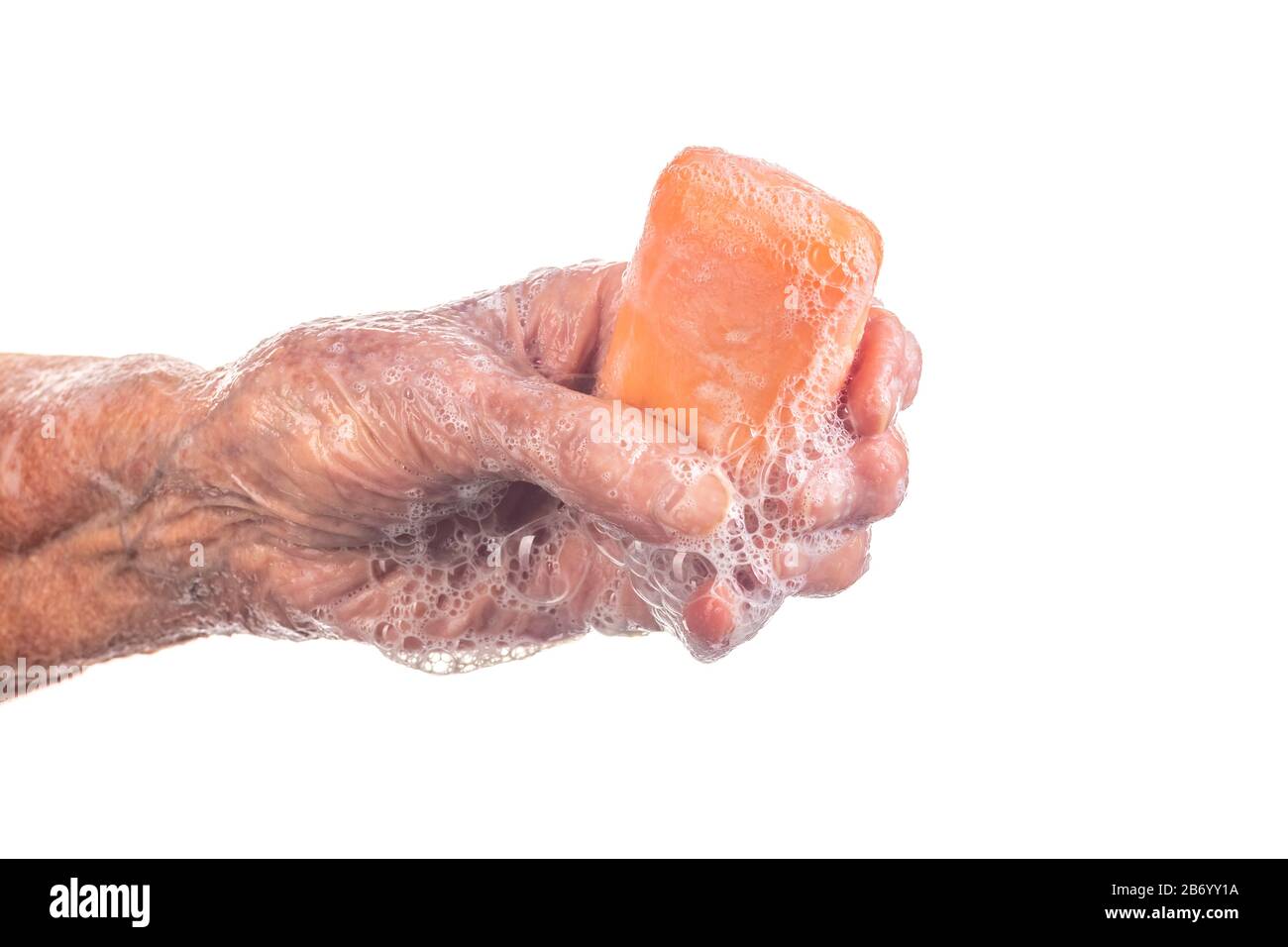 Senior woman washing hands using soap on white background, hygiene ...