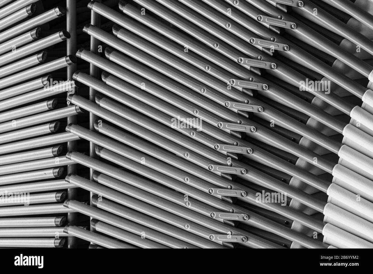 Abstract image of stacked metal chairs Stock Photo - Alamy