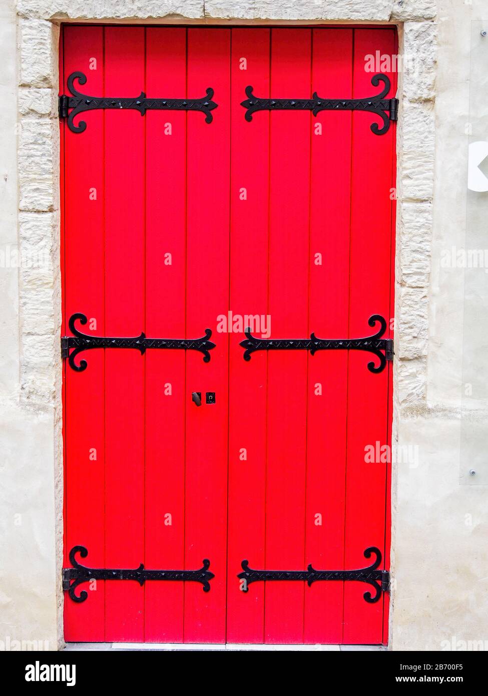 red doors on old building Stock Photo - Alamy