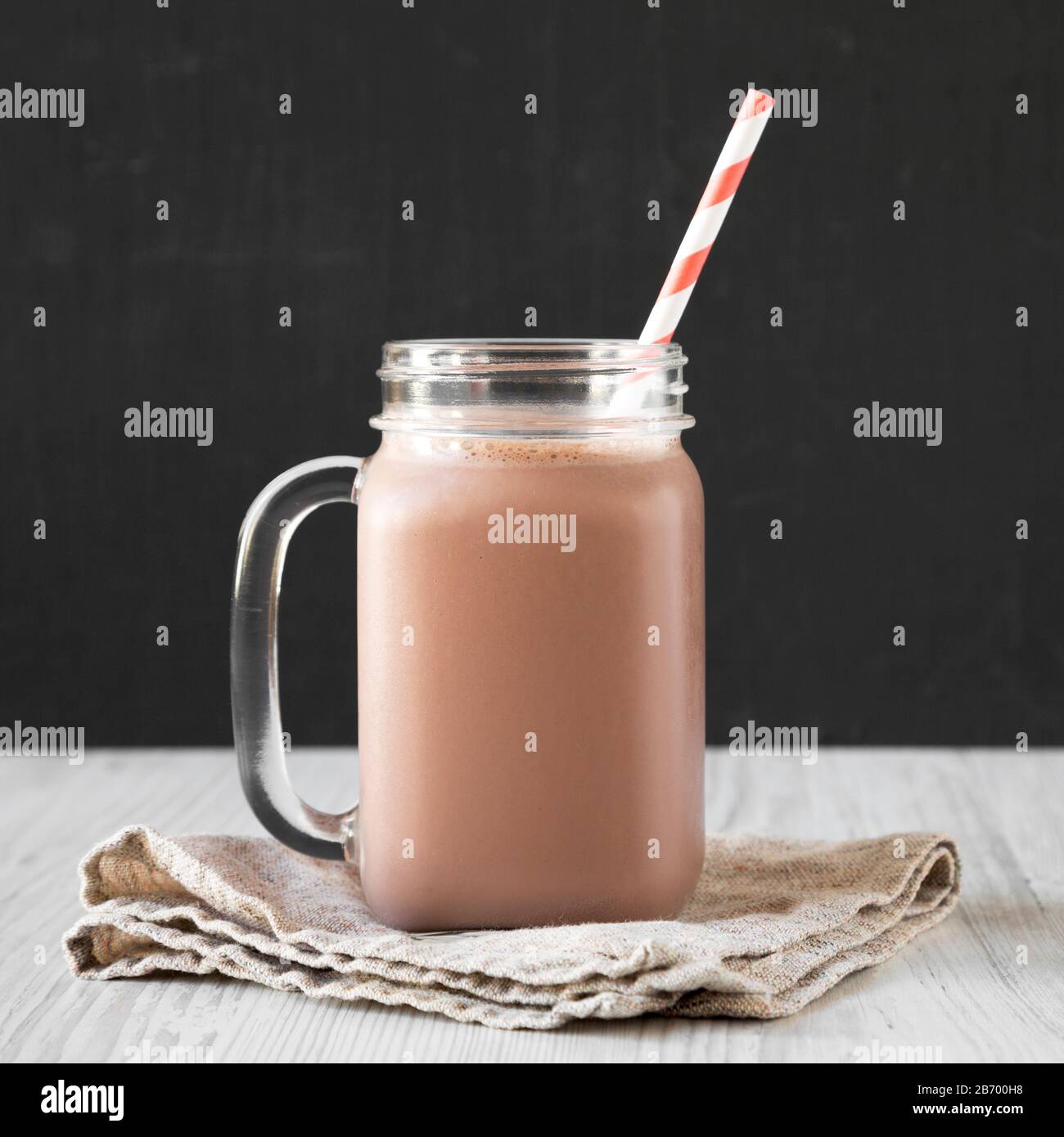 Homemade New England Chocolate Milkshake in a Glass Jar Mug, side view ...