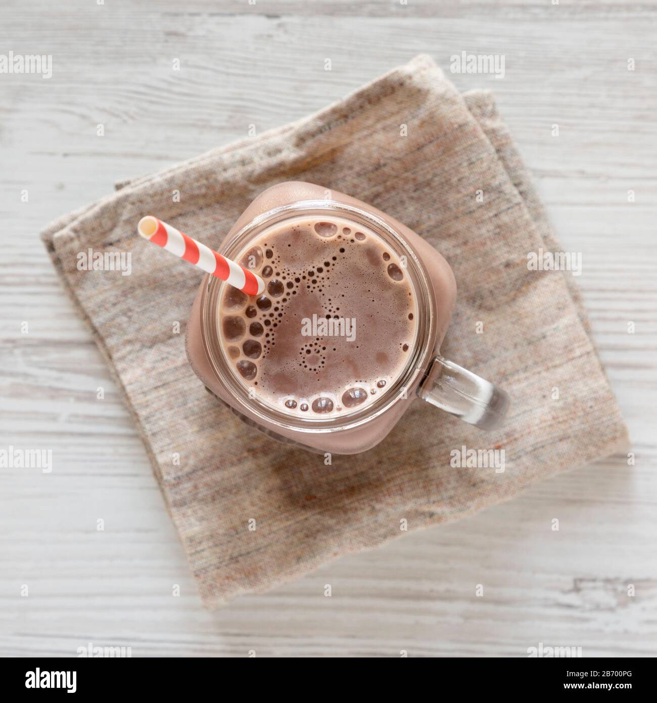 Homemade New England Chocolate Milkshake in a Glass Jar Mug on a white ...