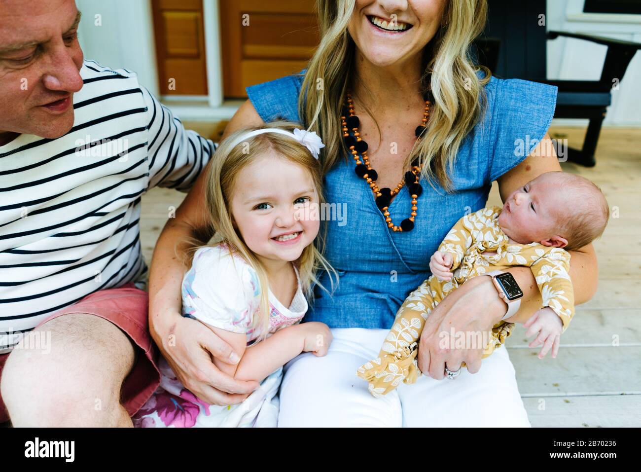 Cropped portrait of a family embraced and laughing together Stock Photo ...