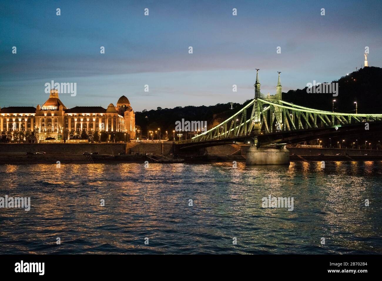 Danube river at night with Danubius Hotel GellÃ©rt and Liberty Bridge ...