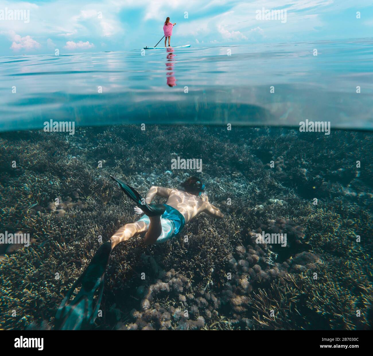 Young couple have a fun in ocean, underwater view Stock Photo - Alamy