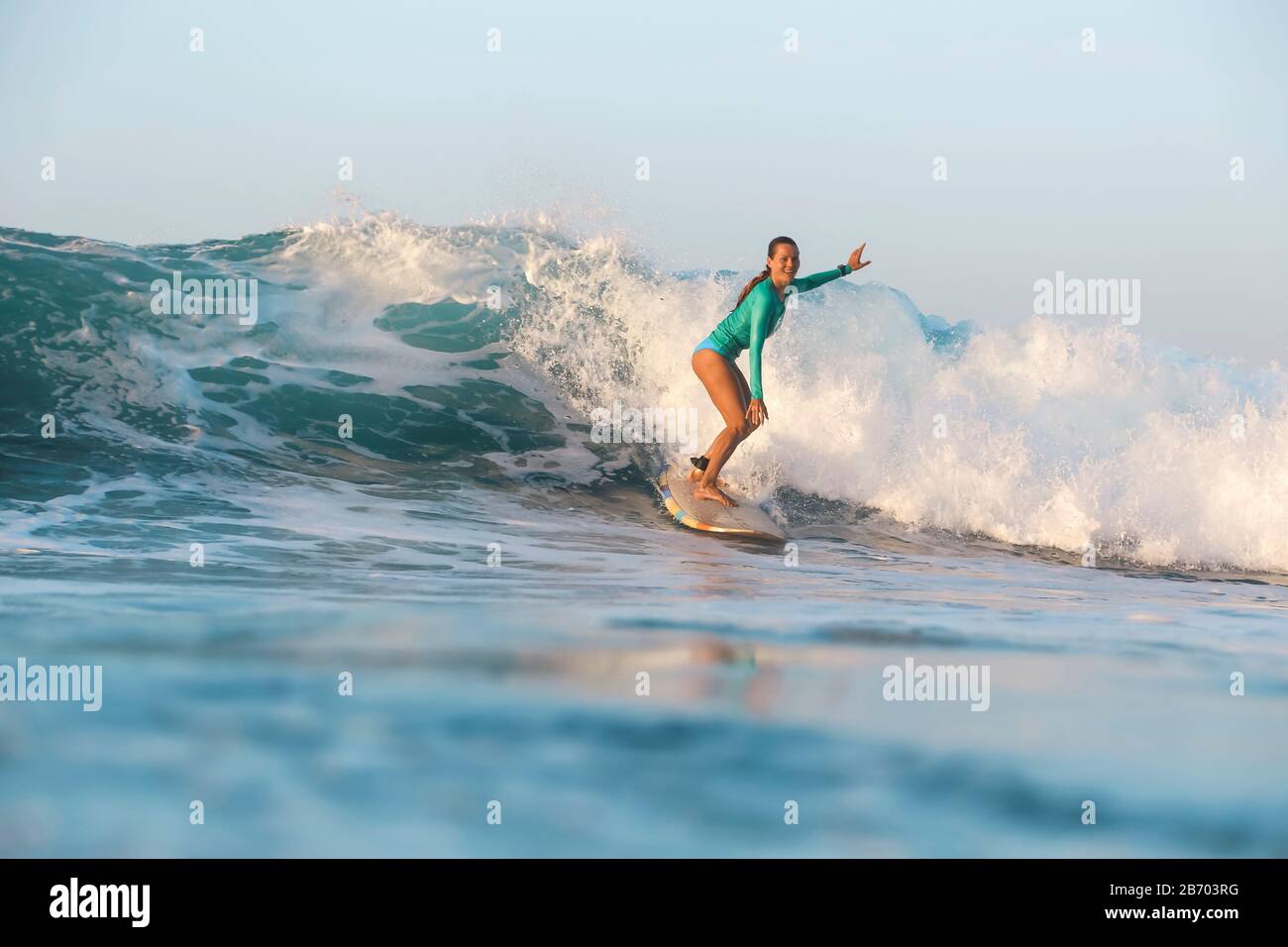 Female surfer on the wave Stock Photo - Alamy