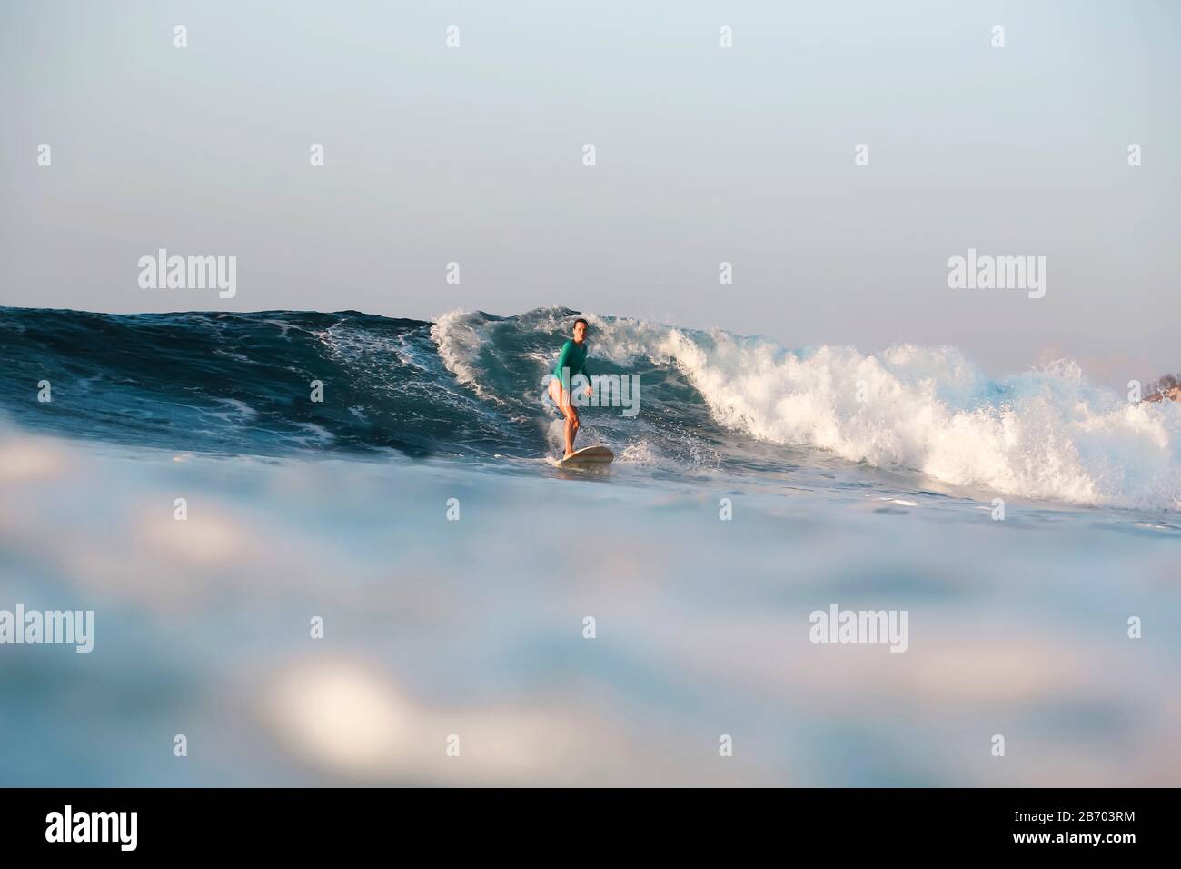 Female surfer on the wave Stock Photo - Alamy