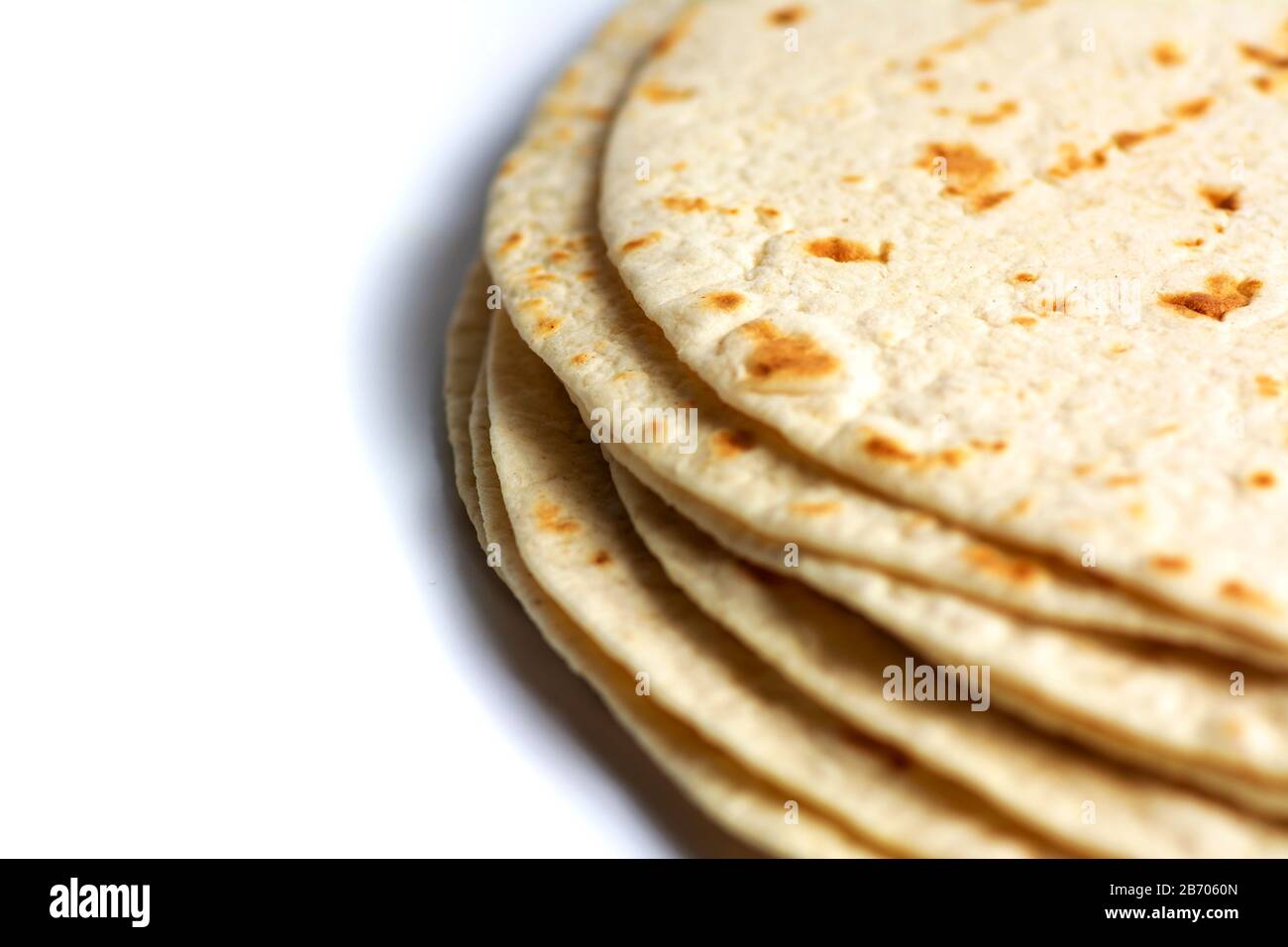 Stack of fresh corn tortillas on white Stock Photo - Alamy