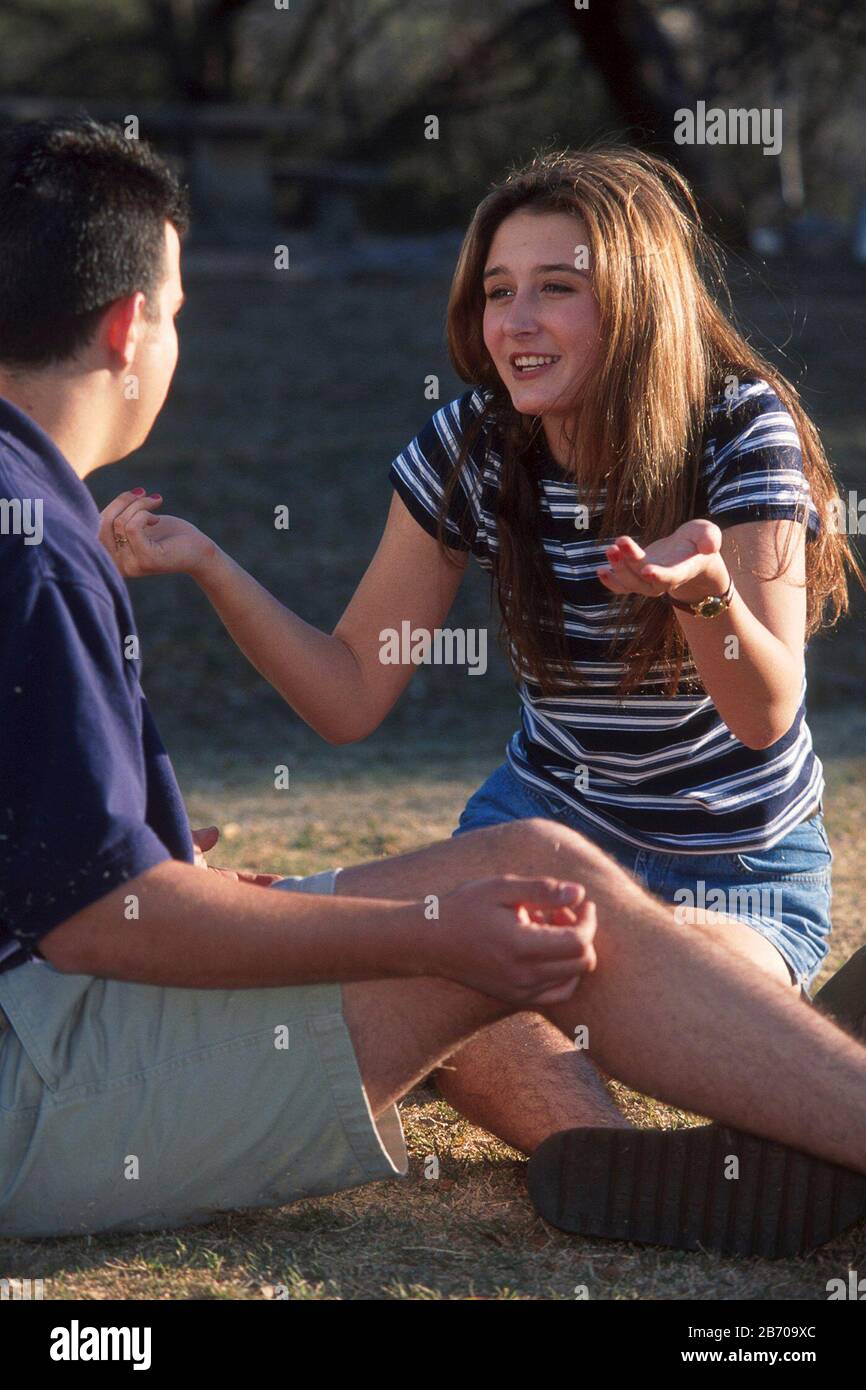 Austin, Texas USA: High school friends hanging out at city park. MR ...