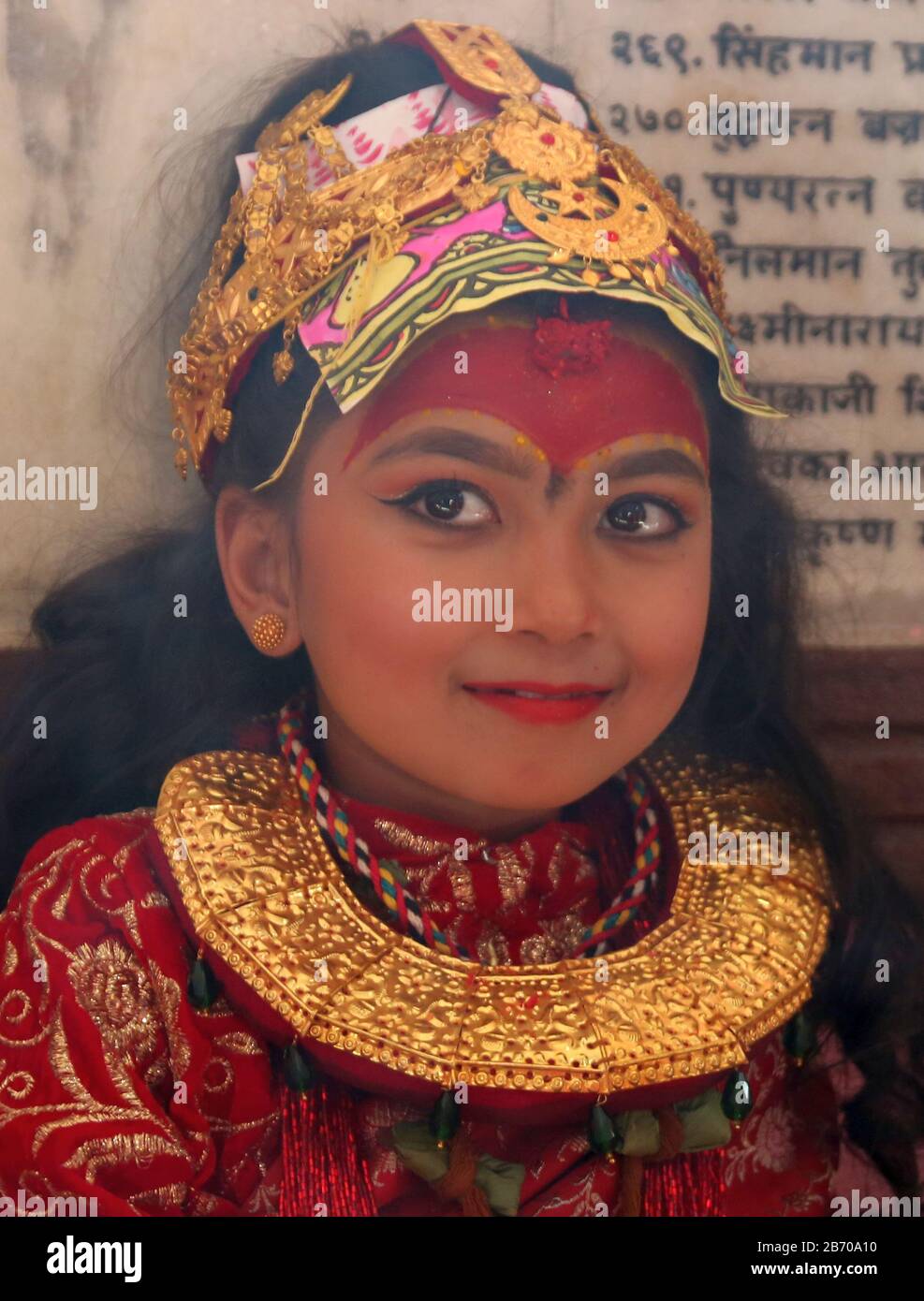 Kavre, Nepal. 12th Mar, 2020. A small girl from Newar community attends ...
