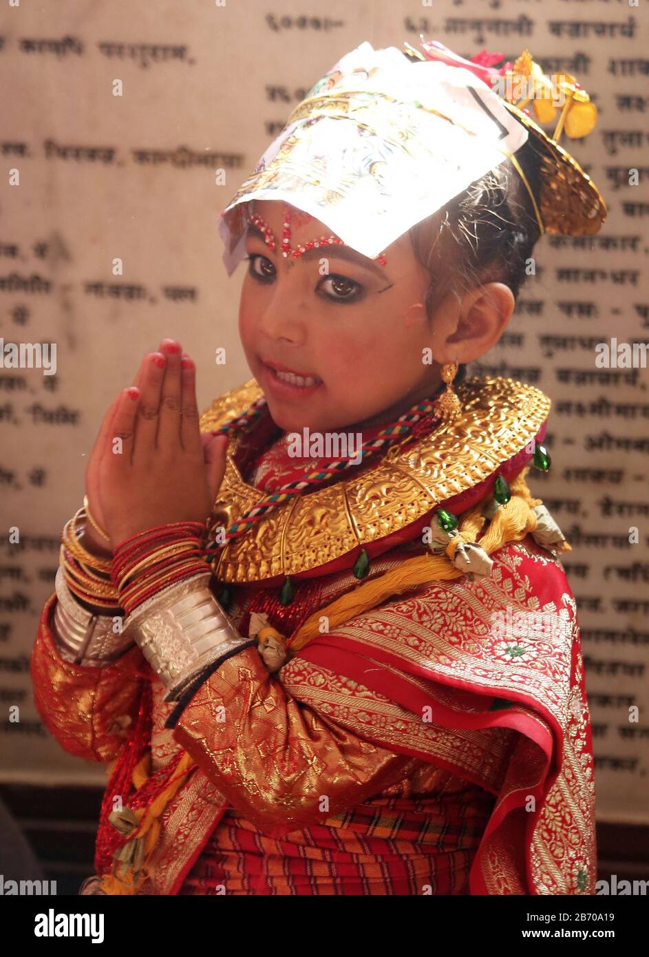 Kavre, Nepal. 12th Mar, 2020. A small girl from Newar community attends ...