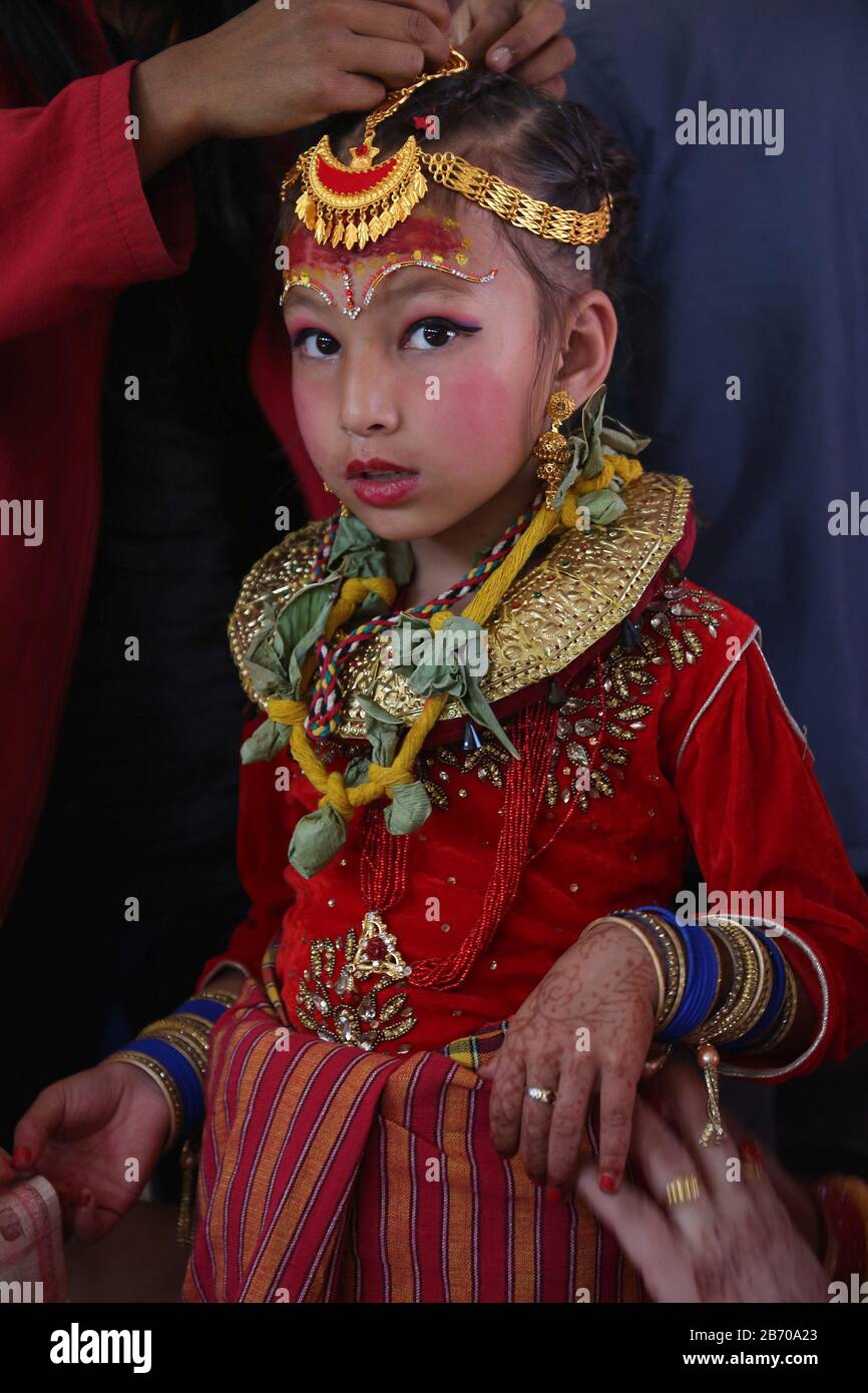 Kavre, Nepal. 12th Mar, 2020. A small girl from Newar community attends ...
