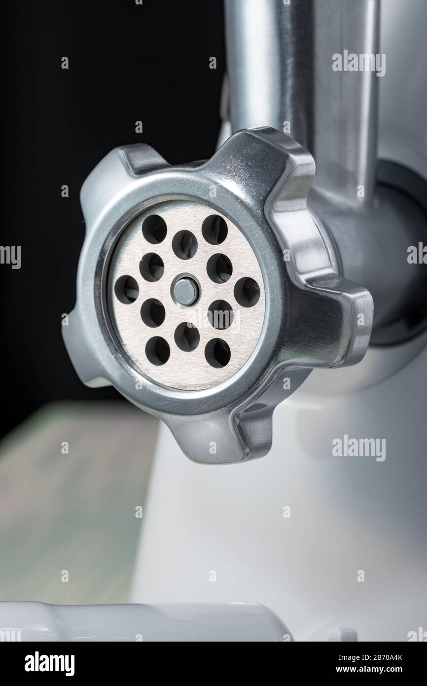 Meat grinder on a black background countertop in the kitchen Stock ...