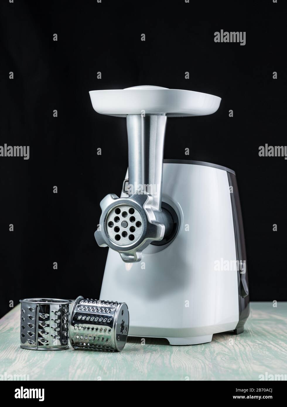Meat grinder on a black background countertop in the kitchen Stock ...