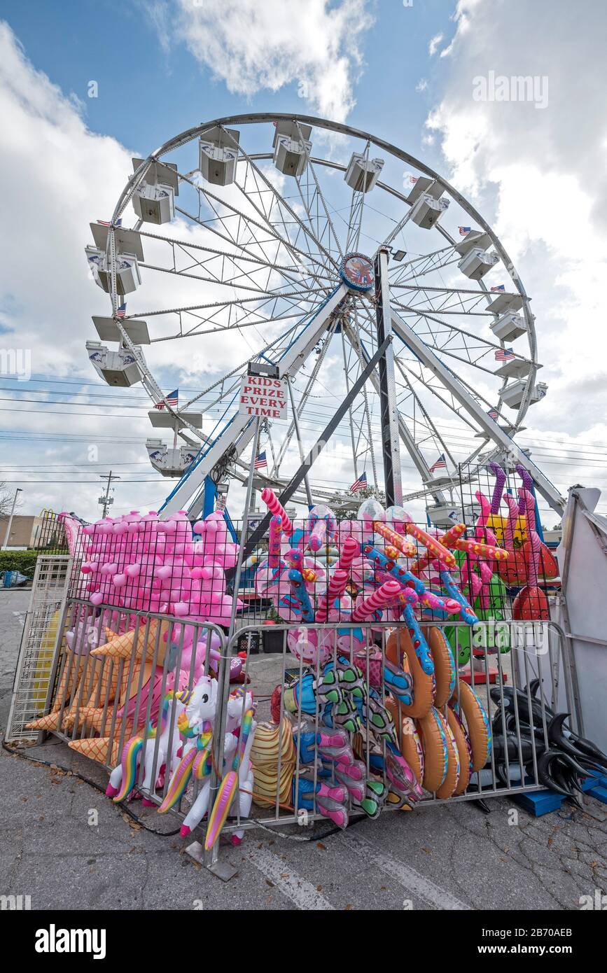 Ferris Wheel with American Flags at a shopping center Carnival in ...