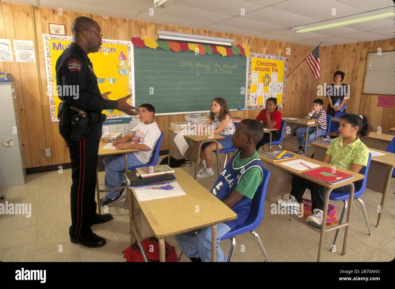 Uniformed cop in classroom hi-res stock photography and images - Alamy