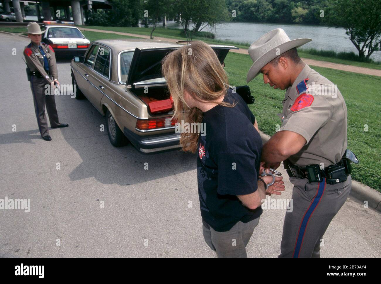 Officer handcuffing suspect hi-res stock photography and images - Alamy