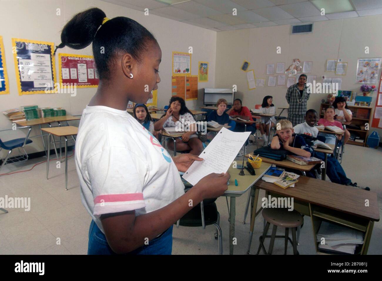 Students listen to classmate presenting report hi-res stock photography ...