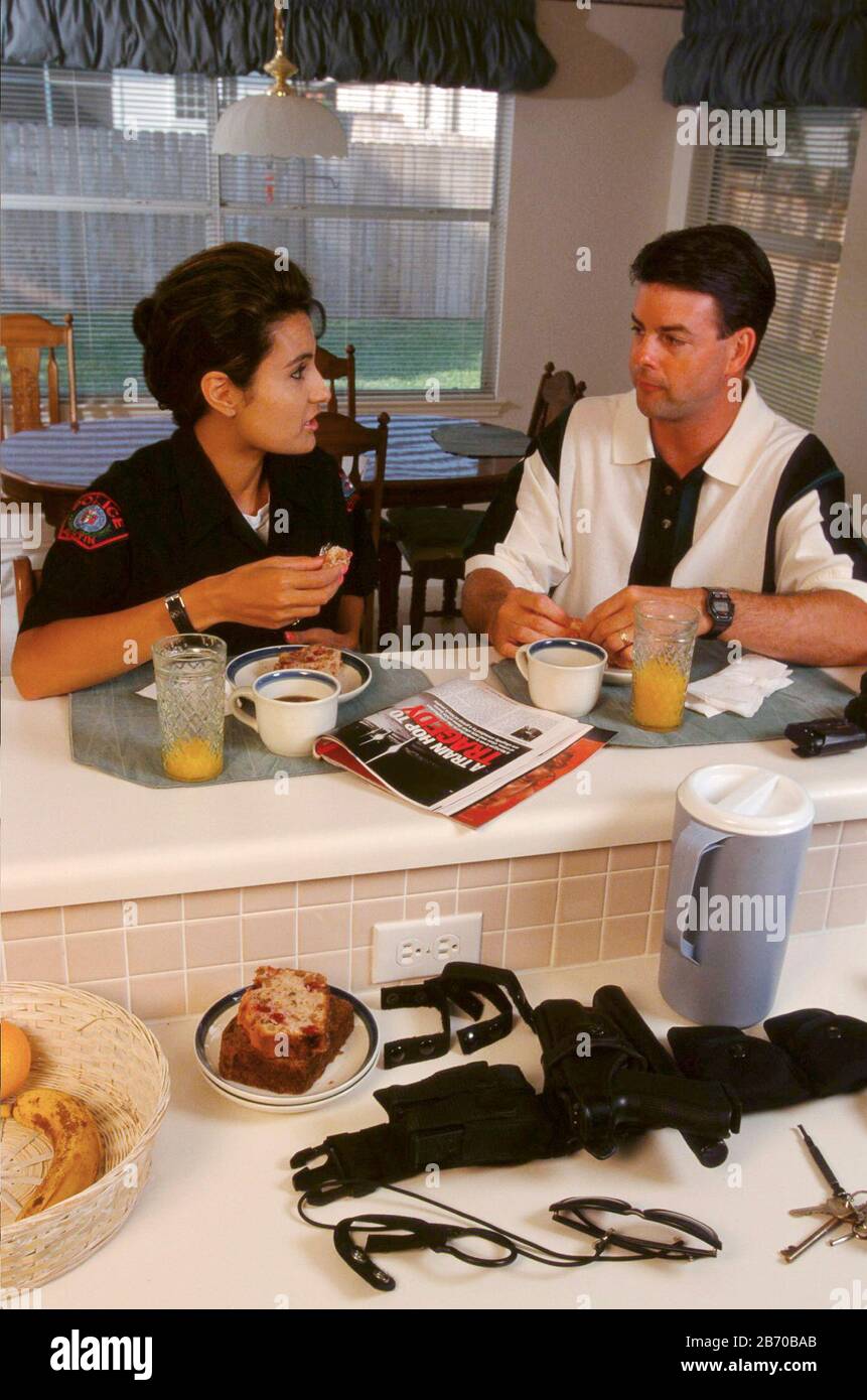 Austin Texas USA: Female police officer and husband eating breakfast at ...