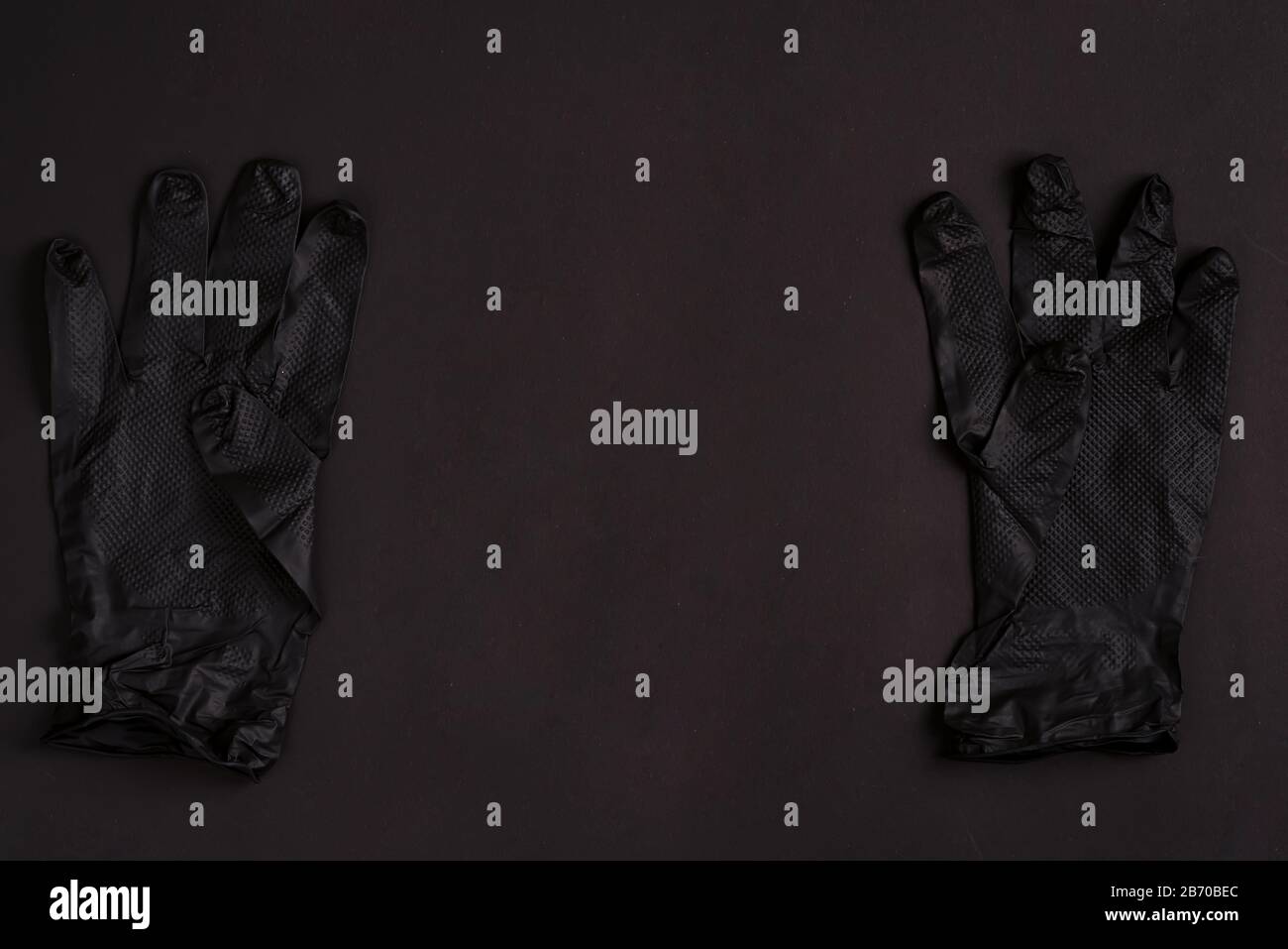 Creative border frame from black rubber disposable gloves for cleaning ...