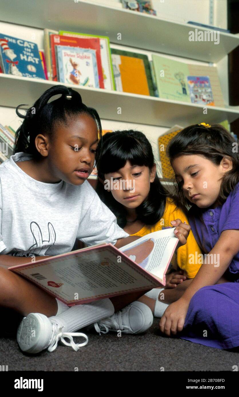 Austin, Texas USA: Elementary students read together in school library ...