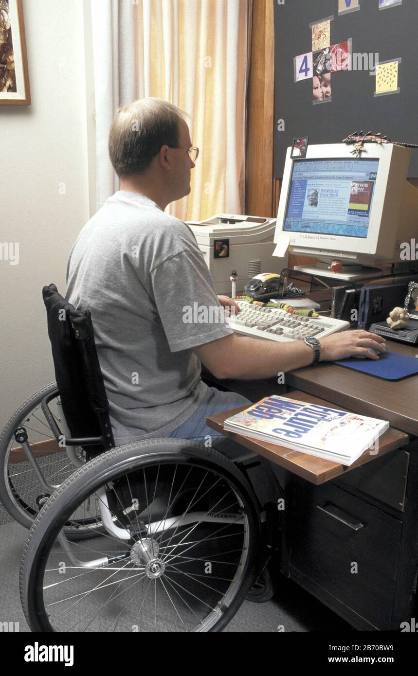 Austin Texas USA, 1998: Wheelchair-bound handicapped male web designer ...