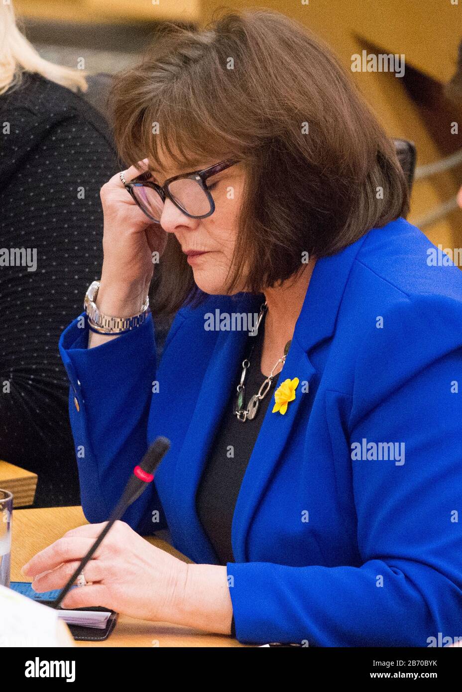 Jeane freeman in deep thought thinking at desk hi-res stock photography ...