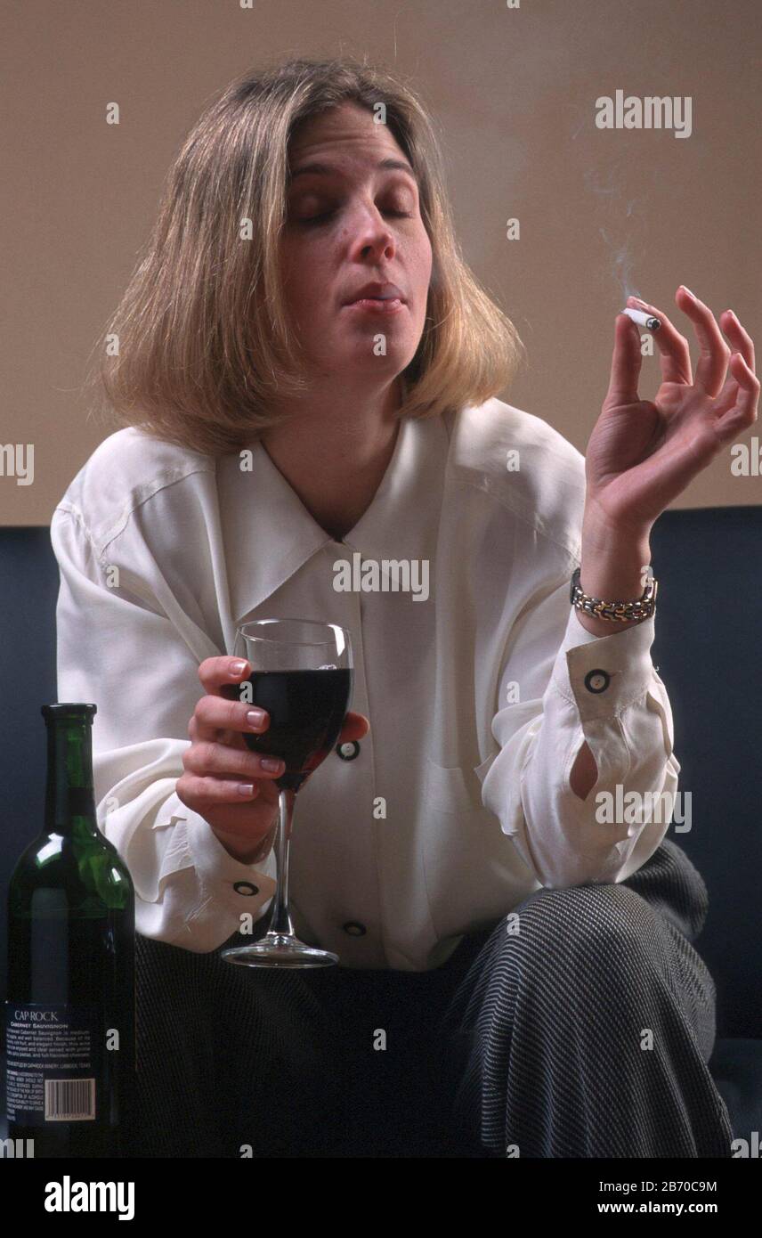 Woman smoking and drinking hi-res stock photography and images - Alamy