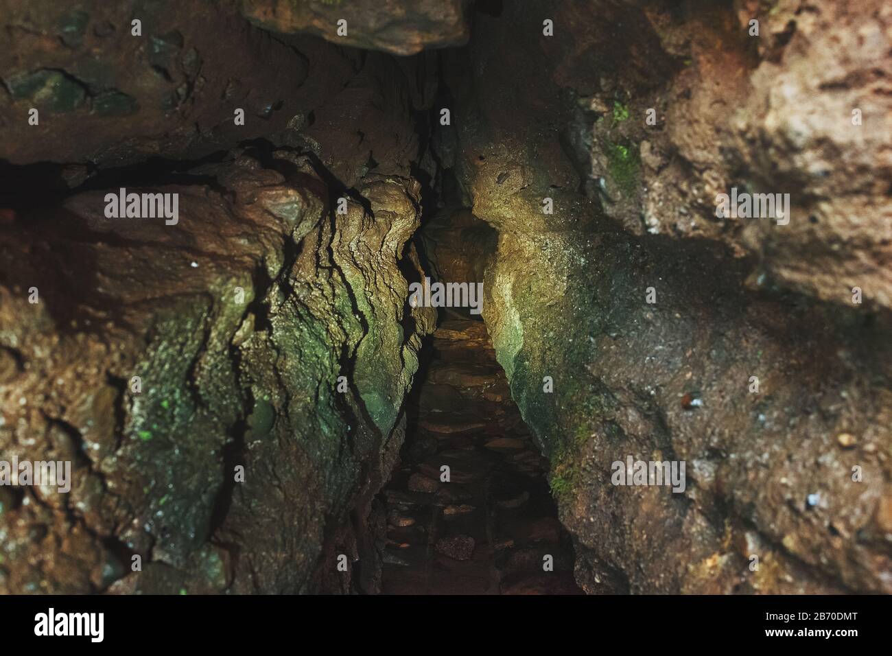 A long tunnel entrance to the cave, underground labyrinths Stock Photo ...