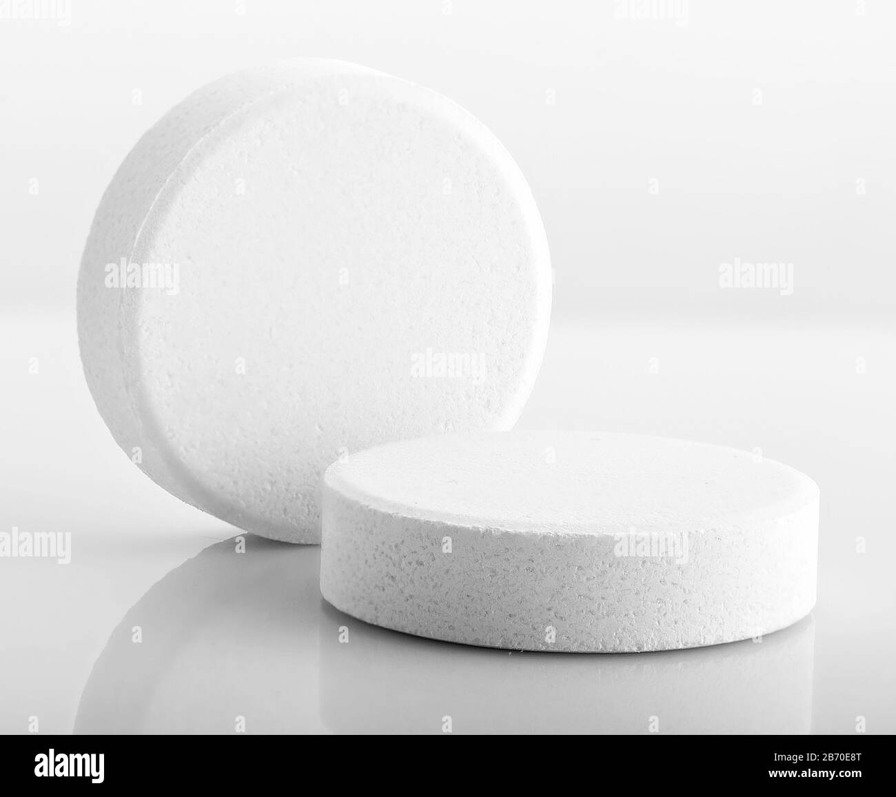 big white medical pill medicine two piece Stock Photo - Alamy