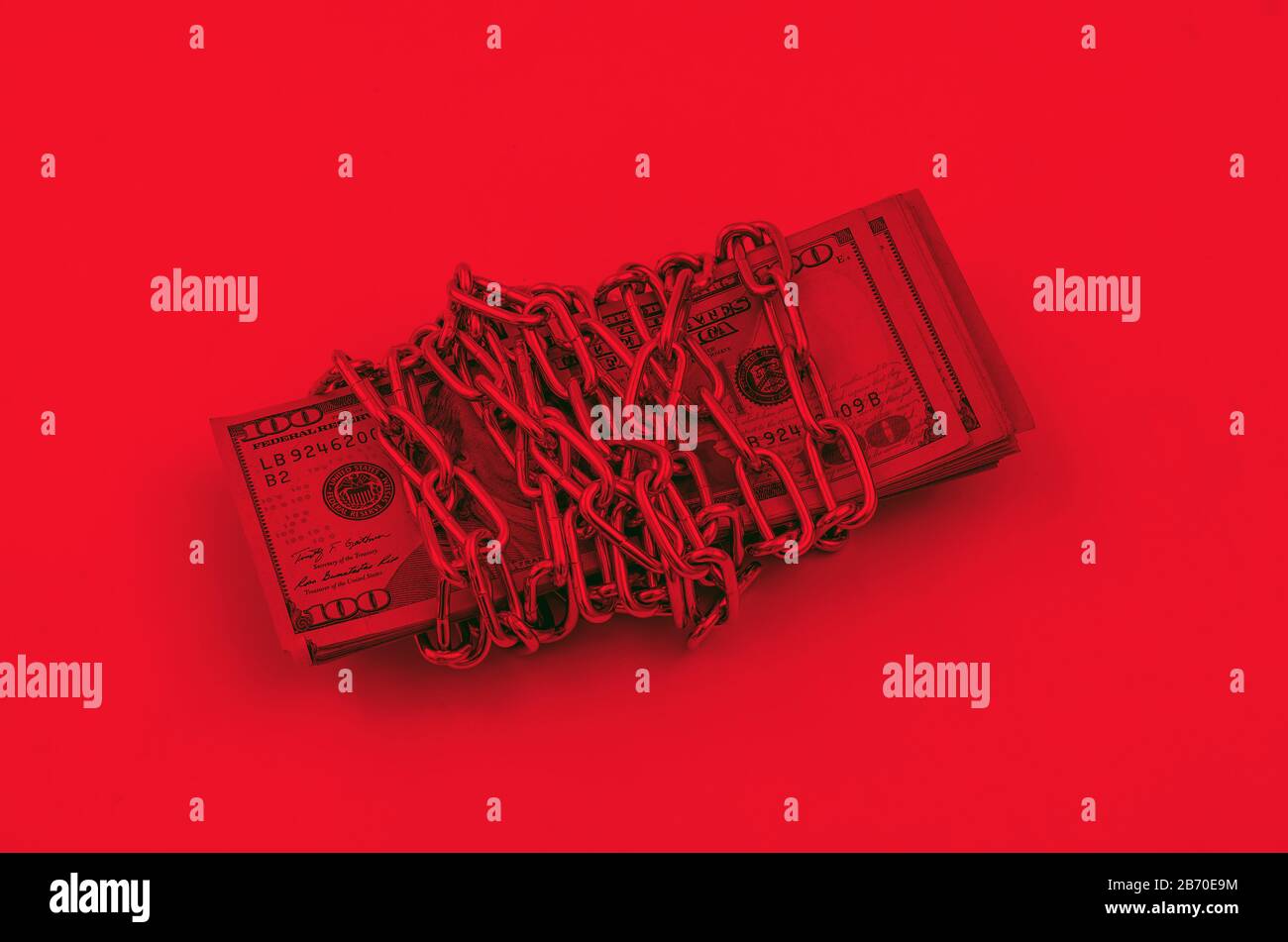 Bundle of American dollars rewound with a metal shiny chain. Isolate on ...