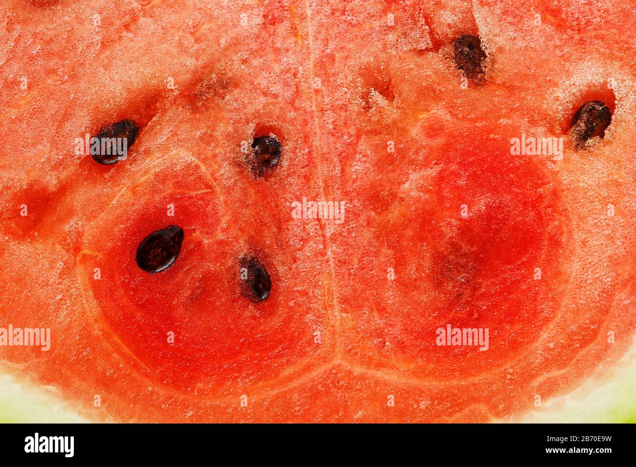 Half slices of tasty and ripe red watermelon on a white background ...