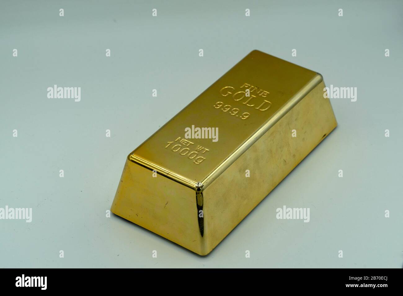 Gold ingot isolated close up Stock Photo - Alamy