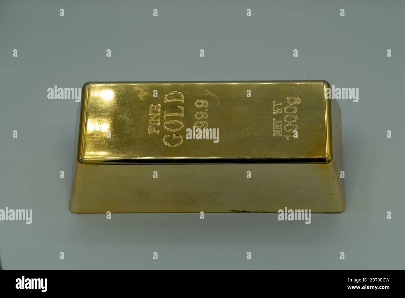 Gold ingot isolated close up Stock Photo - Alamy