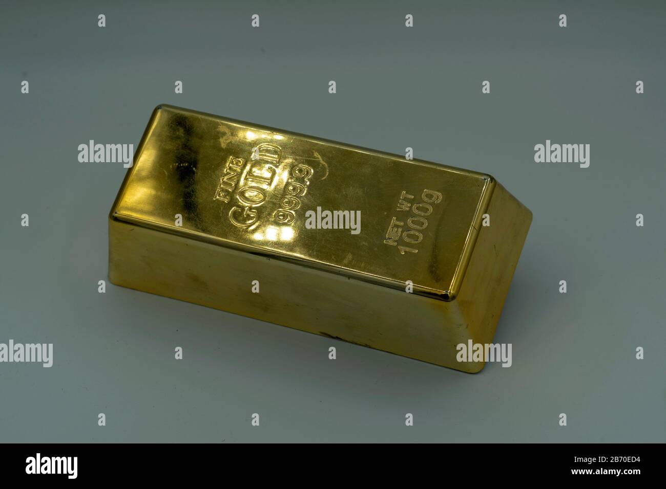 Gold ingot isolated close up Stock Photo - Alamy