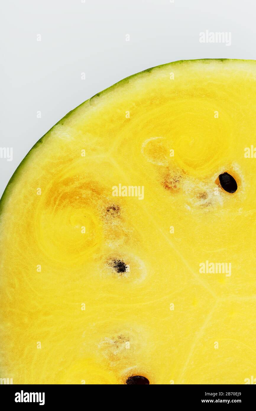 Half a juicy, yellow watermelon on a white background, texture of juicy ...