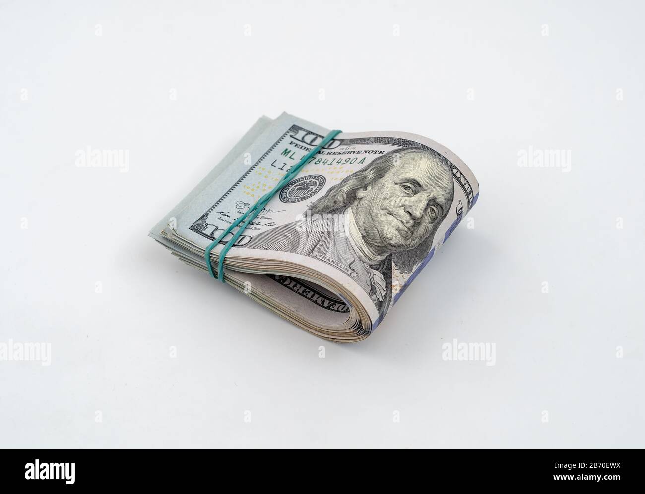 Stack of American dollars tied with a rubber band for money Stock Photo ...