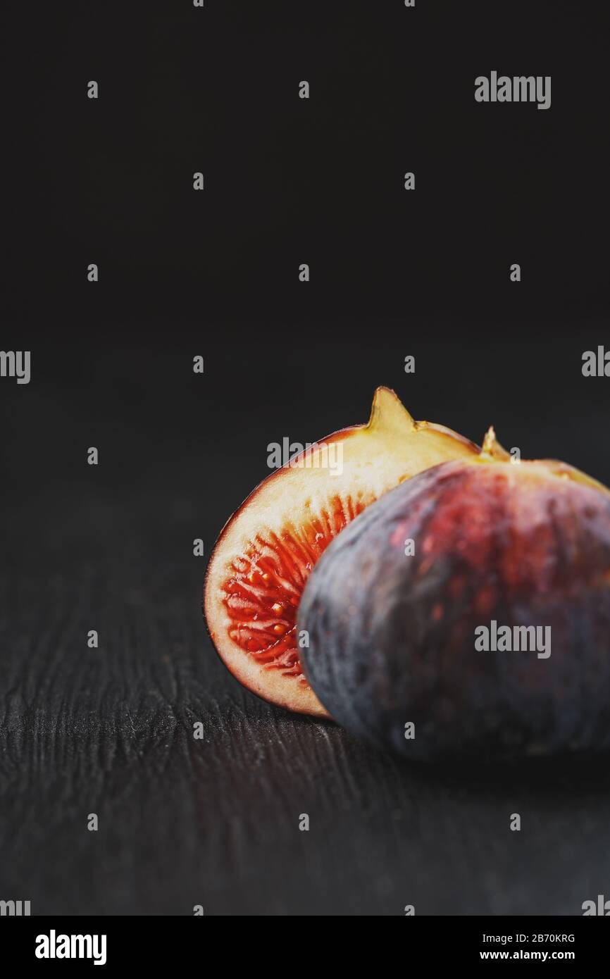 Figs on a dark background, fig flesh close-up. Still life from a group ...