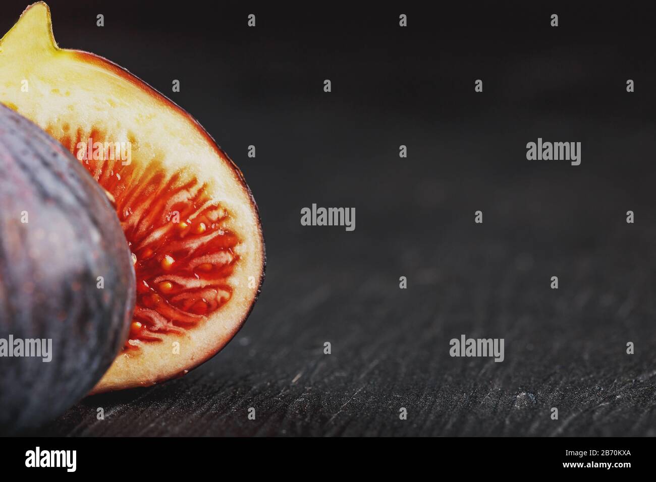 Figs on a dark background, fig flesh close-up. Still life from a group ...