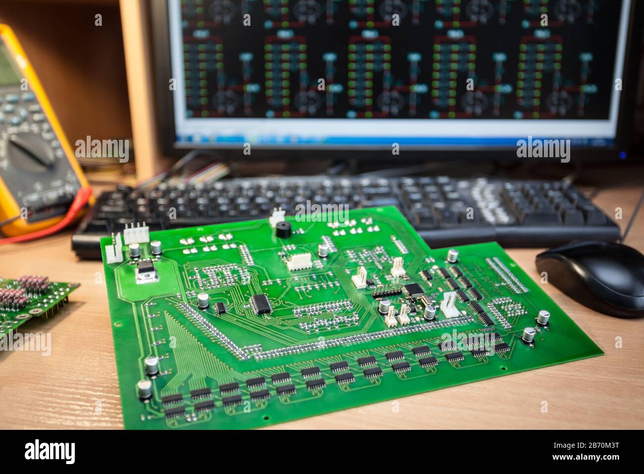 Set of resistors on semiconductor plate, on table is a radio technician ...