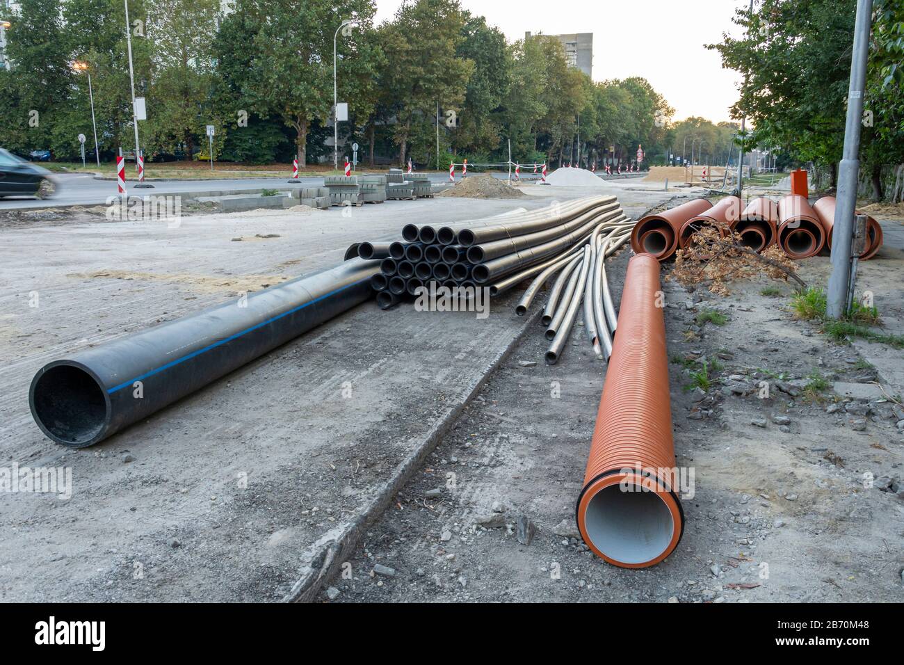 Pvc Pipeline stacked on the road, road construction with pipes Stock ...