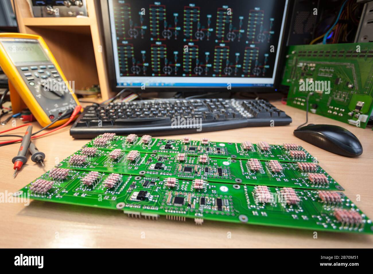 Set of resistors on semiconductor plate, on table is a radio technician ...