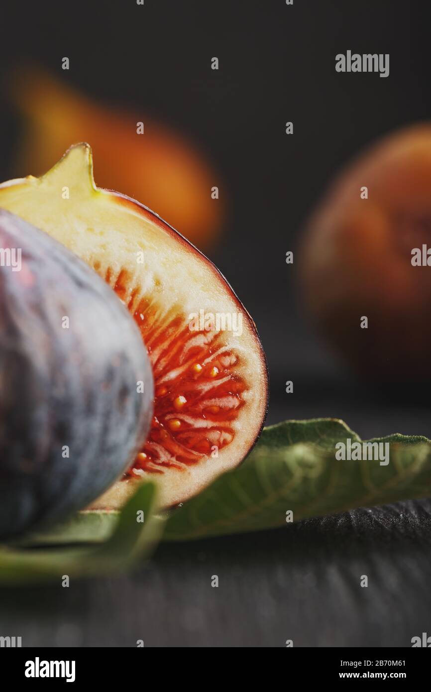 Figs on a dark background, fig flesh close-up. Still life from a group ...