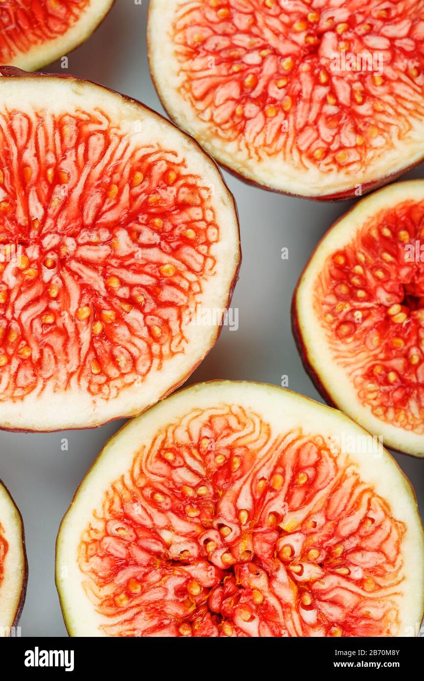 Figs are ripe. Creative diagram of chopped figs on a white background ...