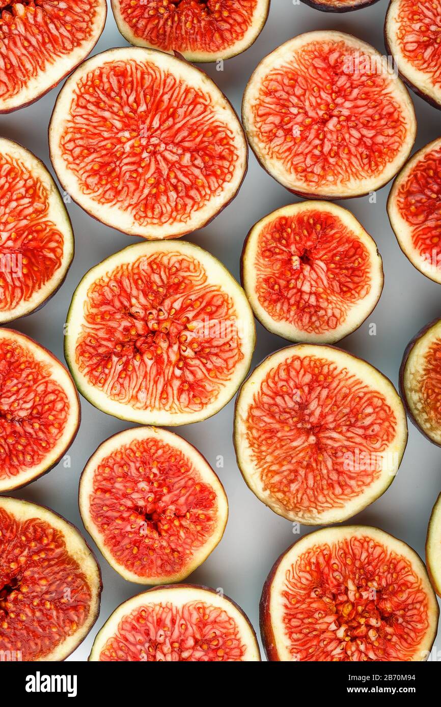 Figs are ripe. Creative diagram of chopped figs on a white background ...