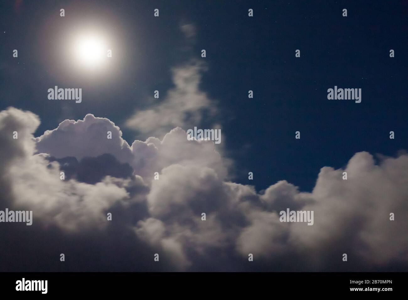 Cloudscape at night sky in moon light Stock Photo - Alamy